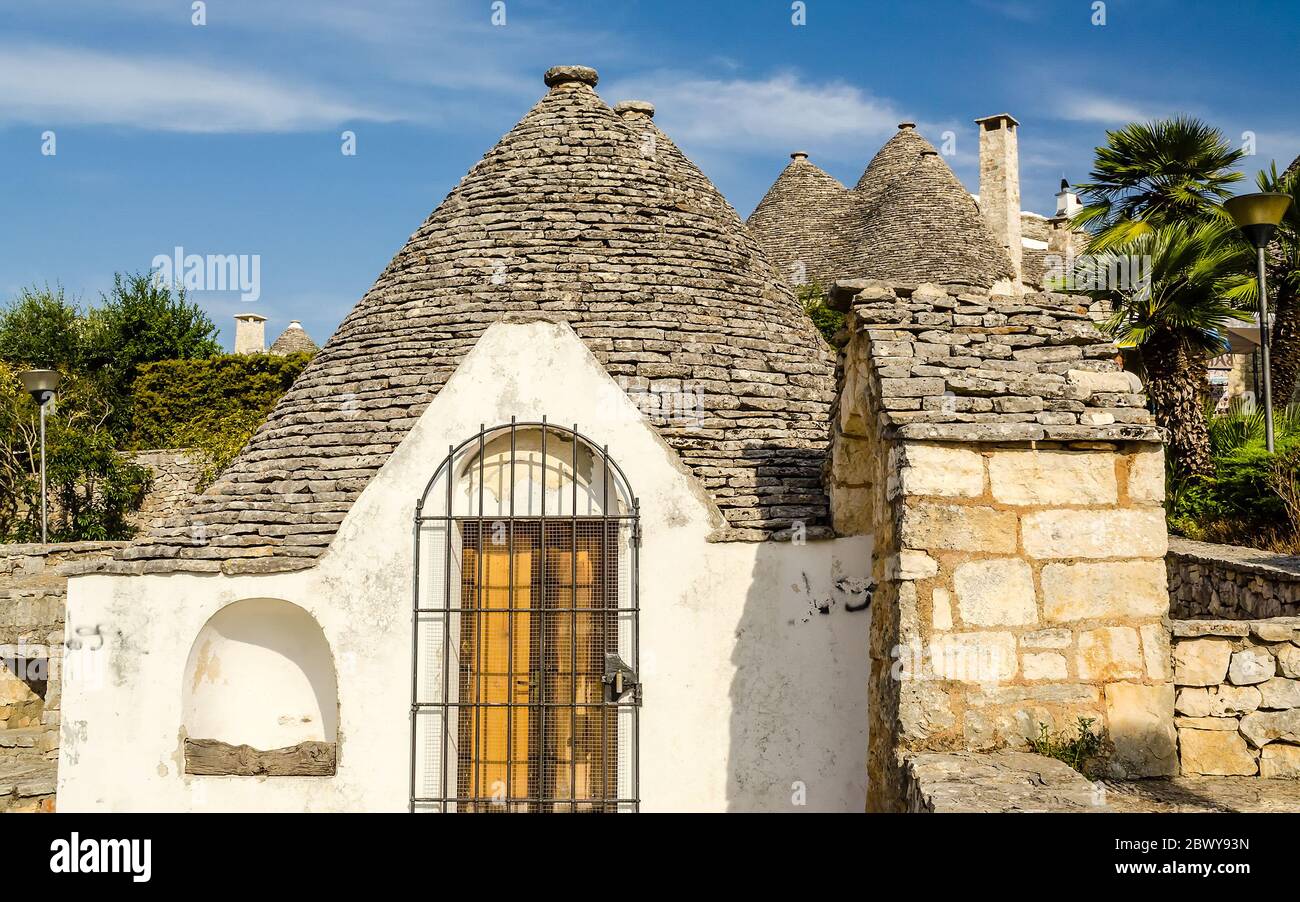 Typical trulli buildings with conical roofs in Alberobello, Apulia ...