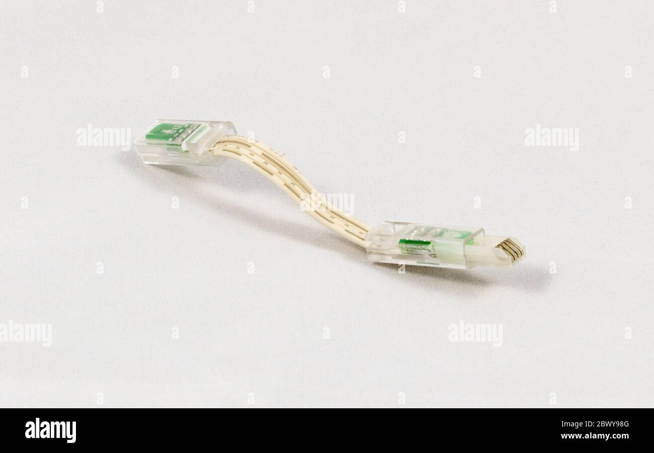 Electronic connector for a led light system, isolated on white ...