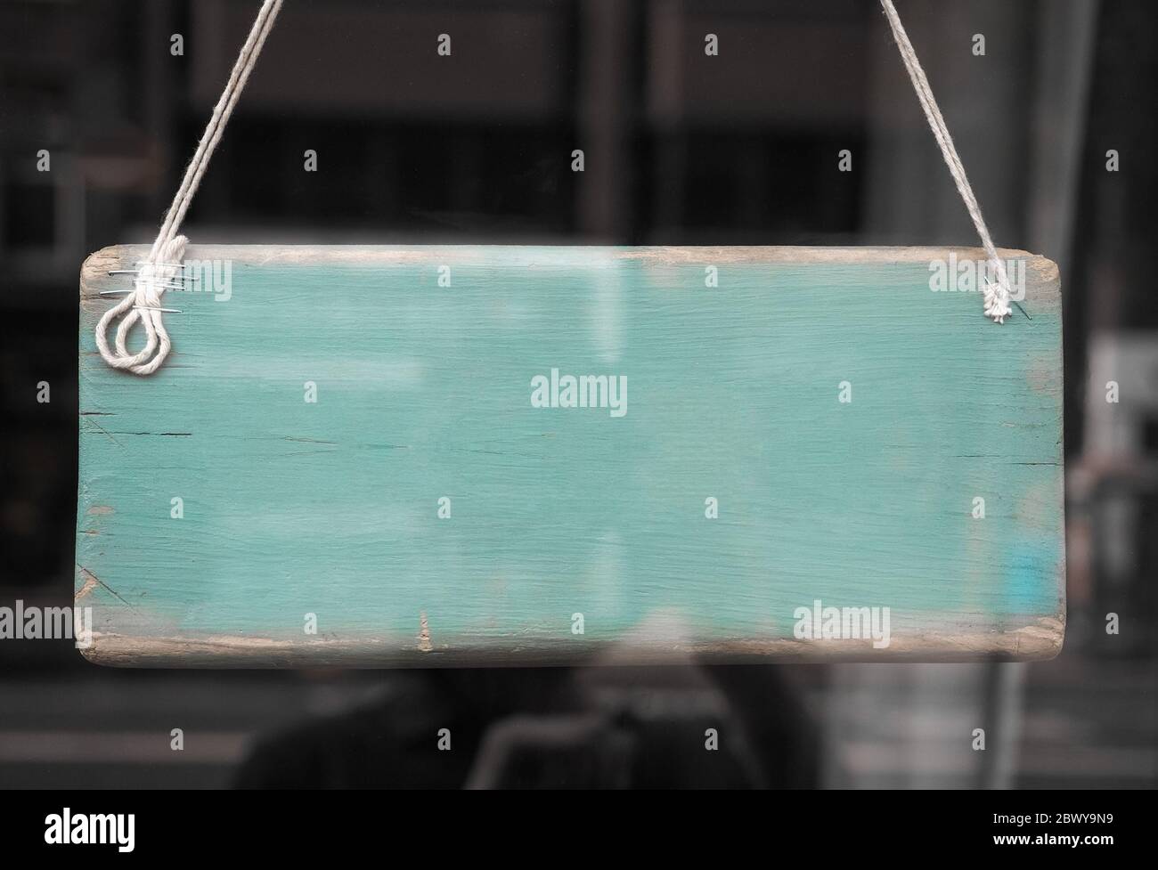 Blank sign in a shop window with reflections and copy space Stock Photo ...