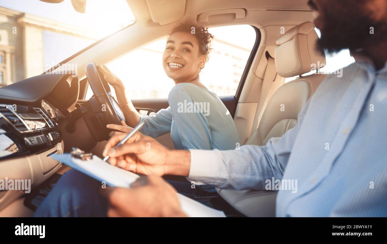 Girl Driving Car Sitting With Instructor During Ride, Panorama, Cropped ...