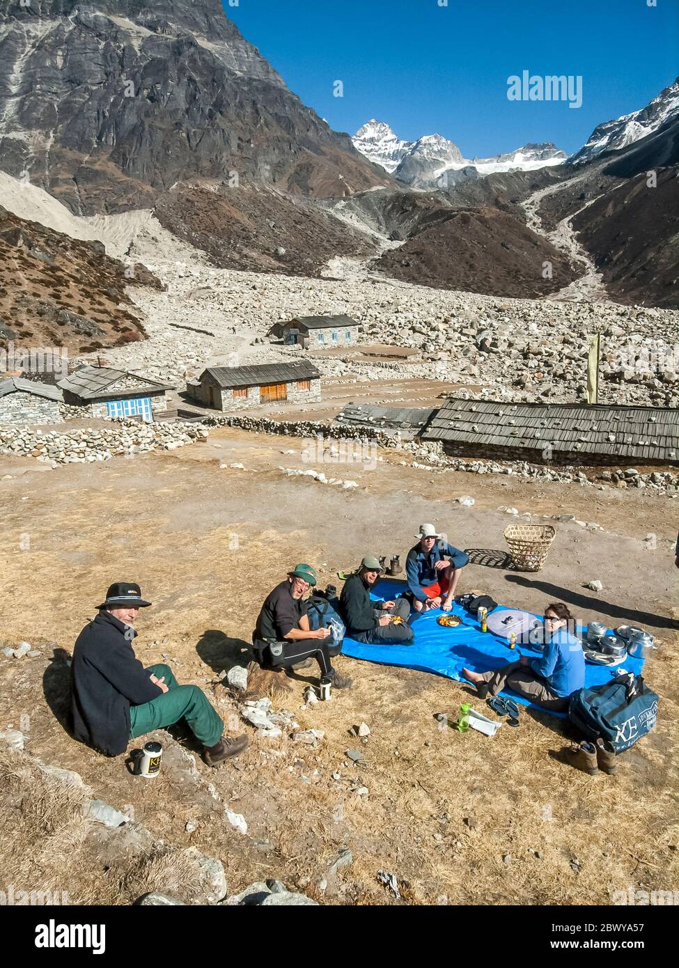 Nepal. Trek to Mera Peak. A group of European trekkers relaxing at the ...