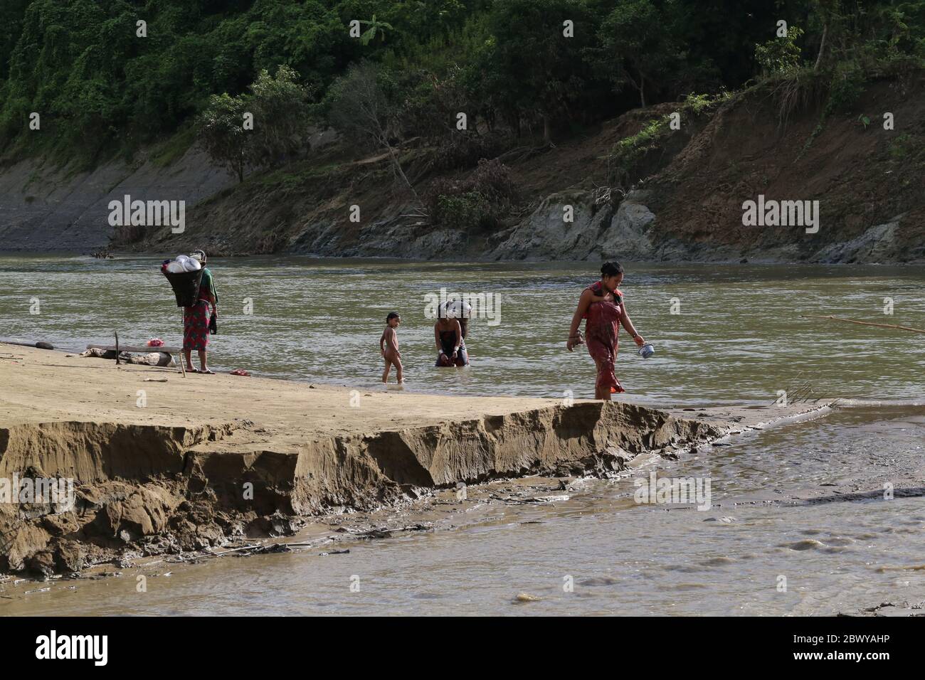 Indigenous people bathe into the Sangu River at Thanchi in Bandarban ...