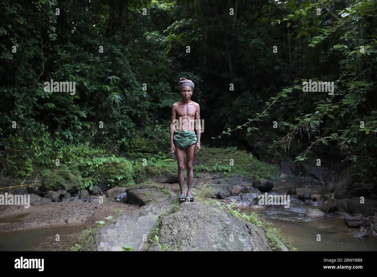 An indigenous man poses for photograph at a village in Thanchi in ...