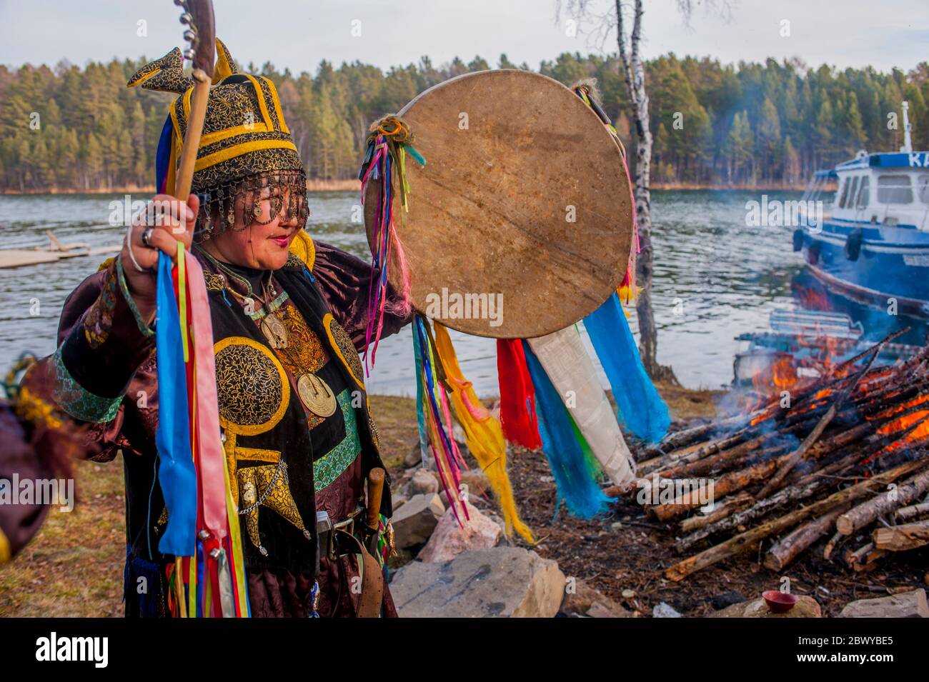 A female Buryat shaman is performing a ceremony near Irkutsk, Siberia ...
