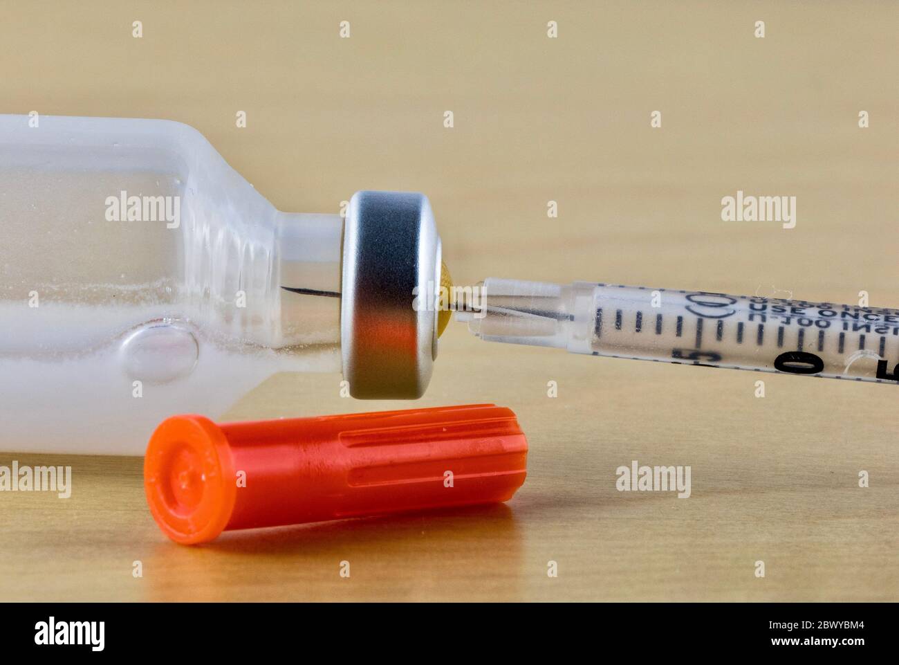 Syringe needle on table hi-res stock photography and images - Alamy