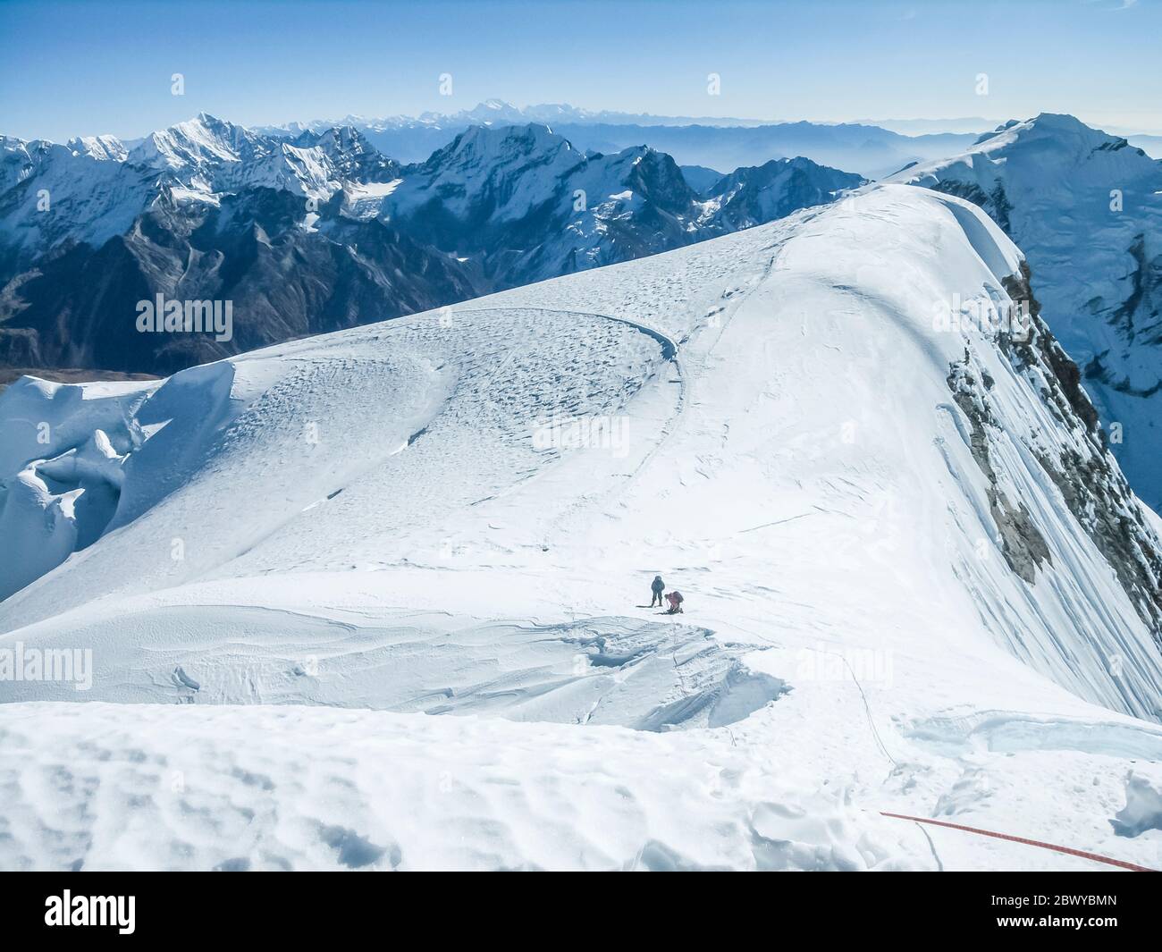 Nepal. Trek to Mera Peak. Climbers on the snow saddle of Mera Peak with ...