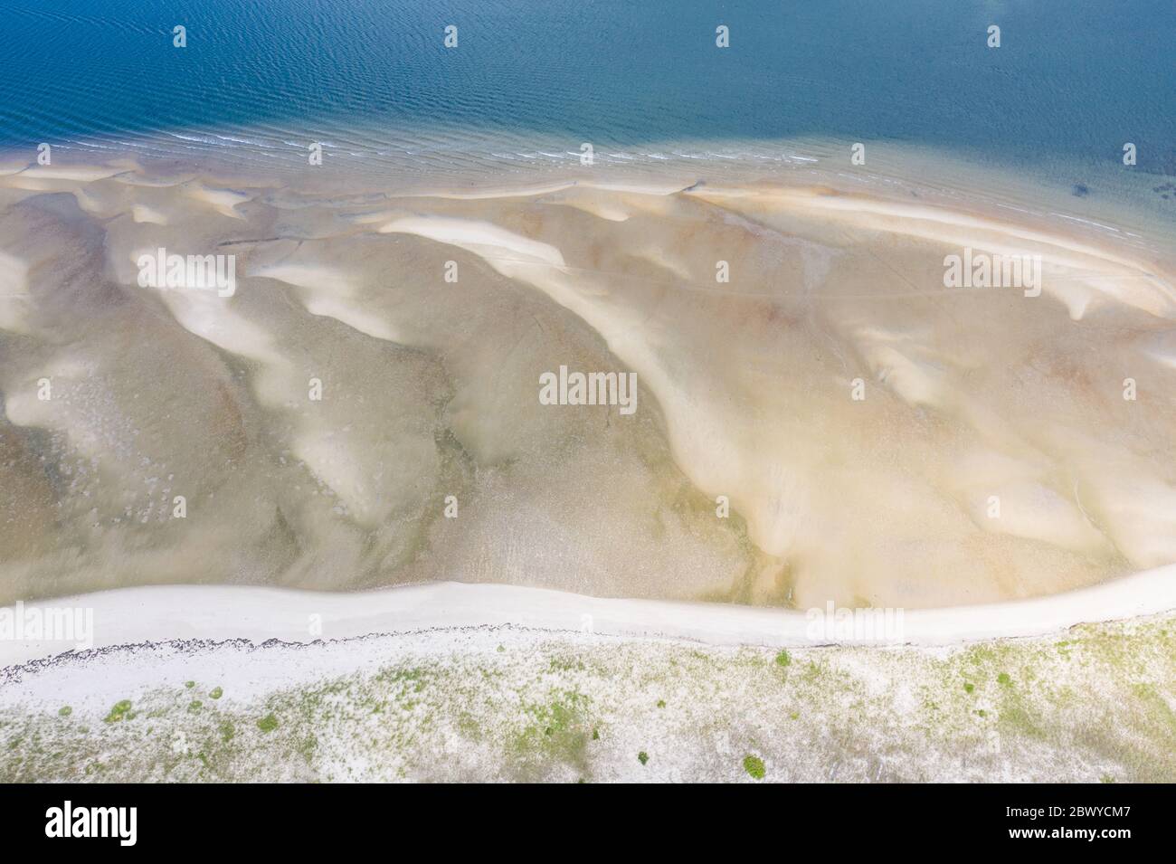 The cold waters of the Atlantic Ocean wash onto the beaches of Cape Cod ...