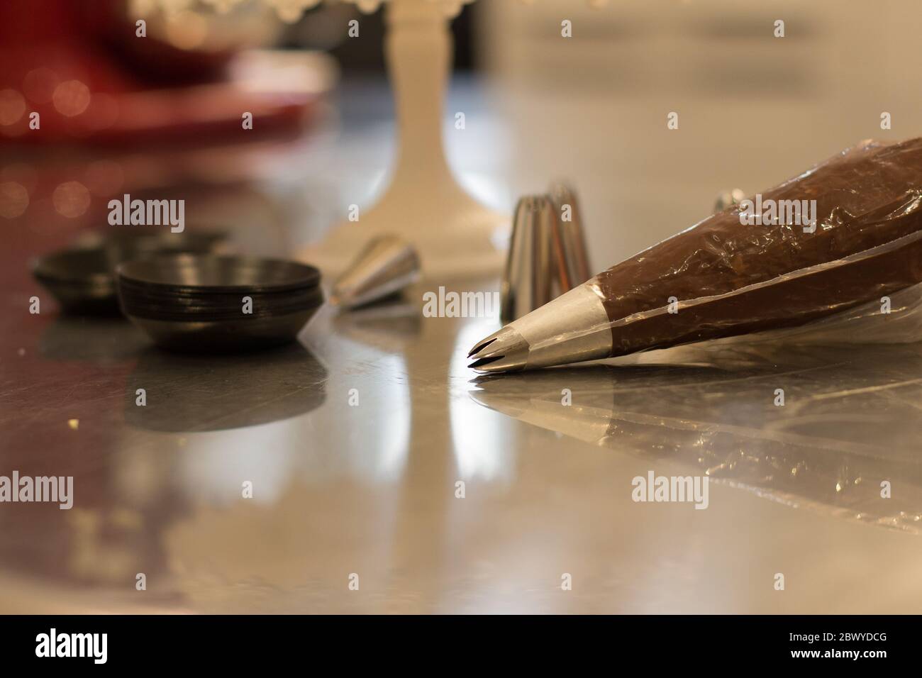 Detail of the preparation of macaron, french sweet food, inside a ...