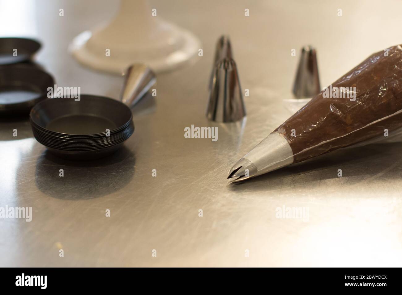 Detail of the preparation of macaron, french sweet food, inside a ...