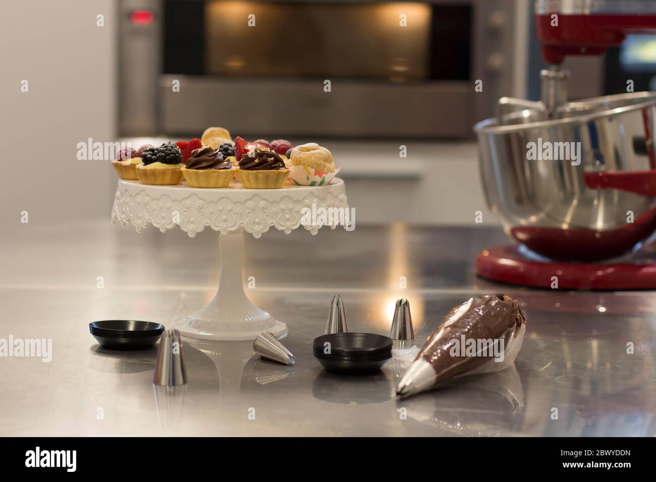 Detail of the preparation of macaron, french sweet food, inside a ...
