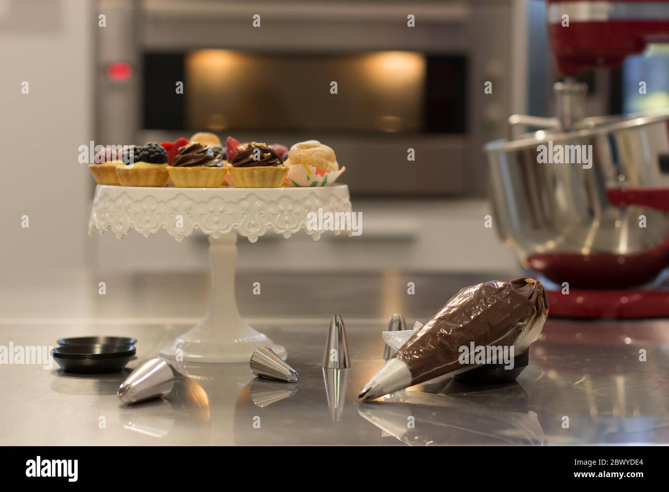 Detail of the preparation of macaron, french sweet food, inside a ...