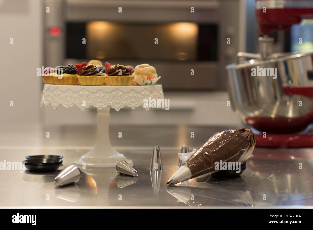 Detail of the preparation of macaron, french sweet food, inside a ...