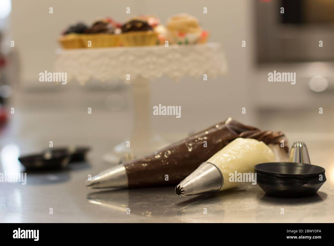 Detail of the preparation of macaron, french sweet food, inside a ...