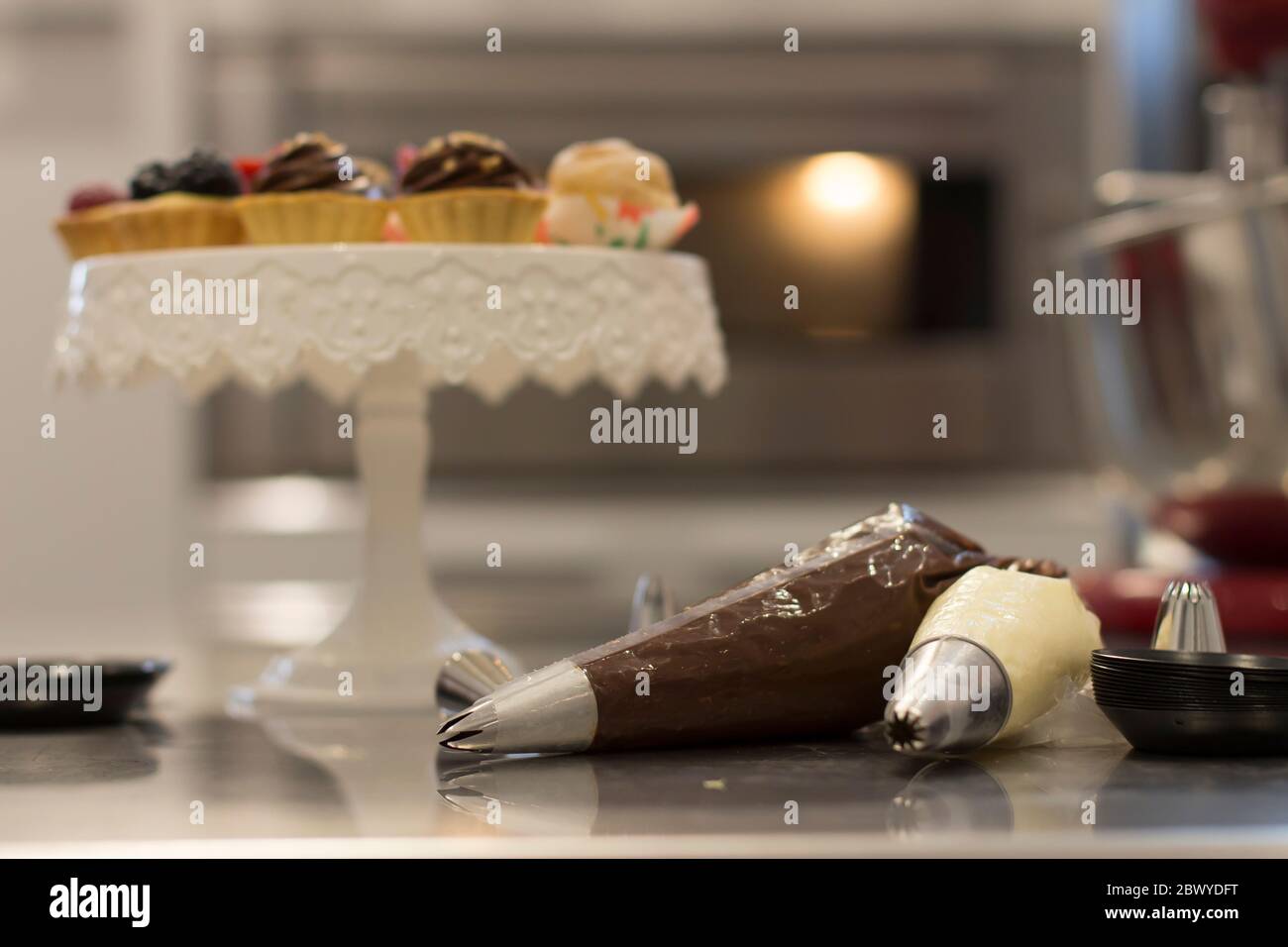 Detail of the preparation of macaron, french sweet food, inside a ...