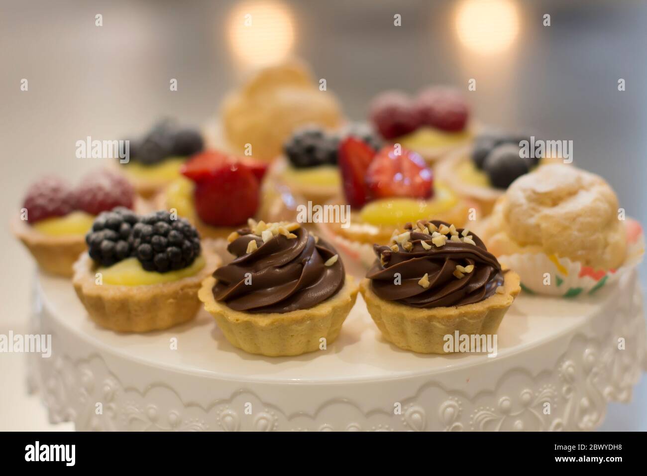 Detail of the preparation of macaron, french sweet food, inside a ...