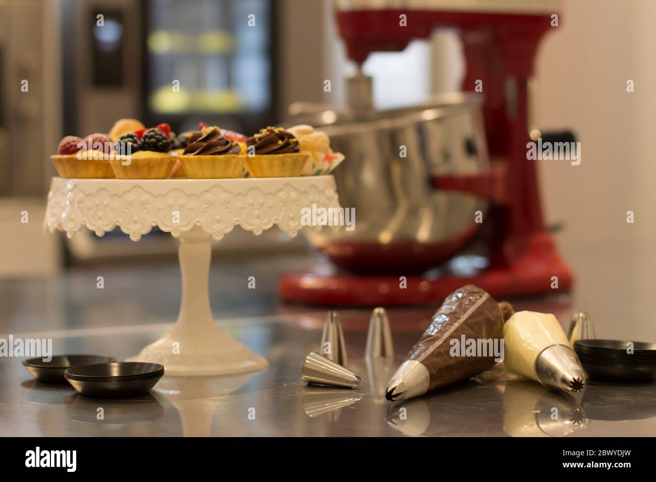 Detail of the preparation of macaron, french sweet food, inside a ...