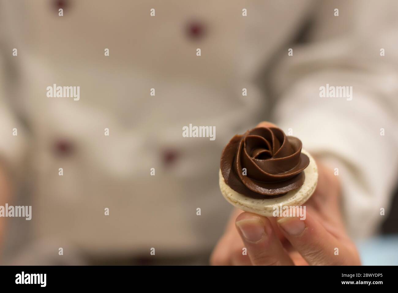 Detail of the preparation of macaron, french sweet food, inside a ...