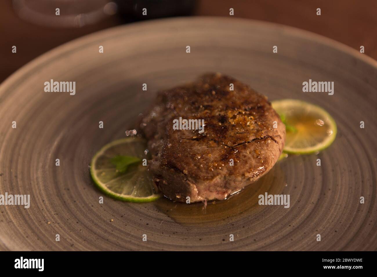 Lime fillet gourmet recipe resting on a restaurant table, no people are ...