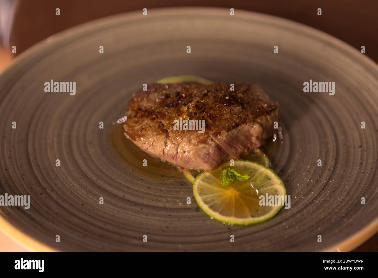 Lime fillet gourmet recipe resting on a restaurant table, no people are ...