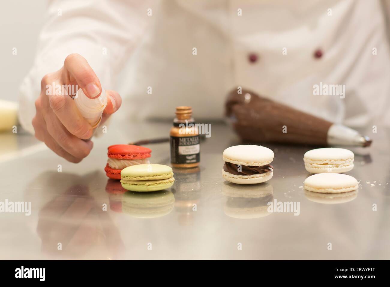 Detail of the preparation of macaron, french sweet food, inside a ...