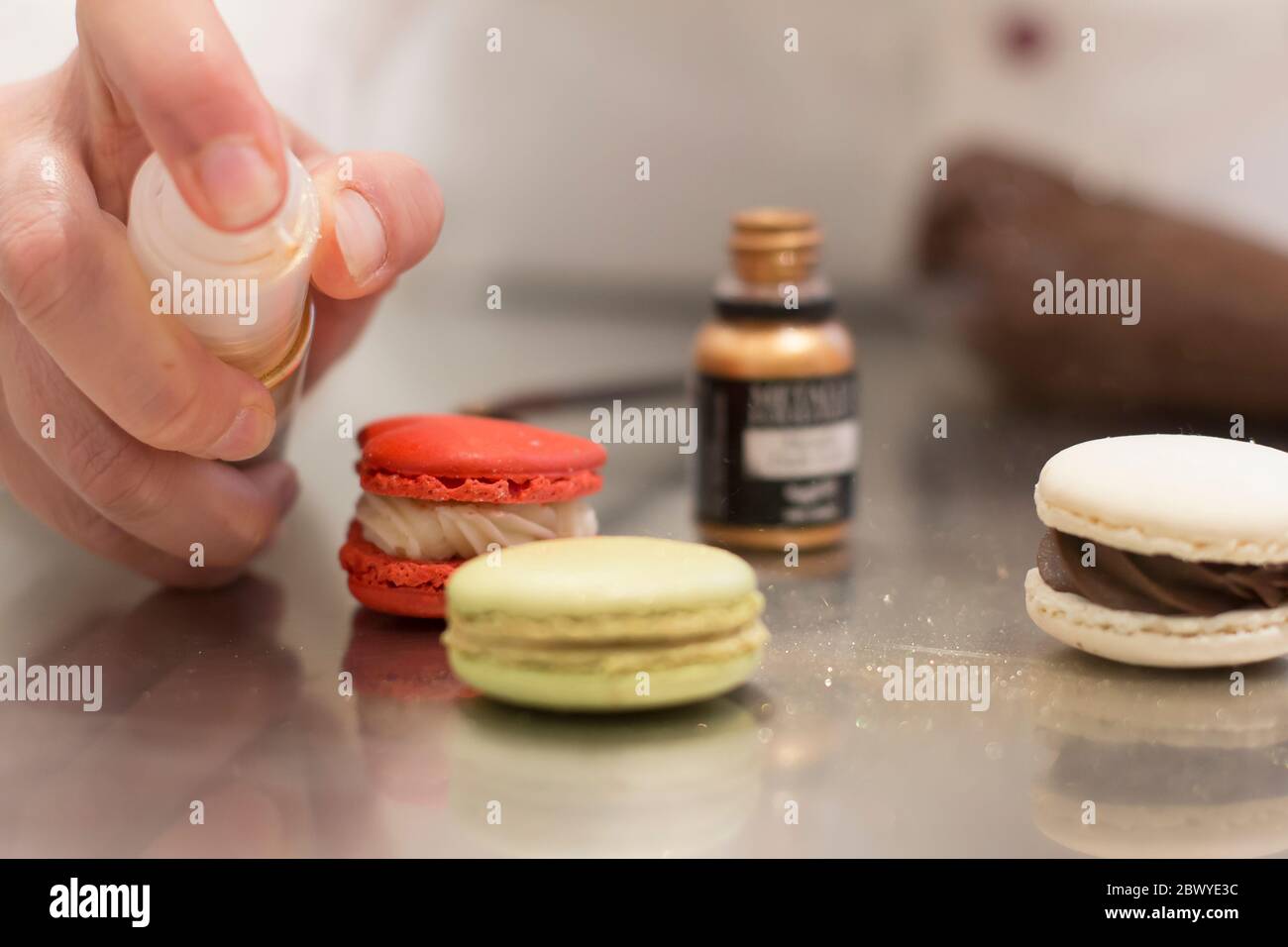 Detail of the preparation of macaron, french sweet food, inside a ...