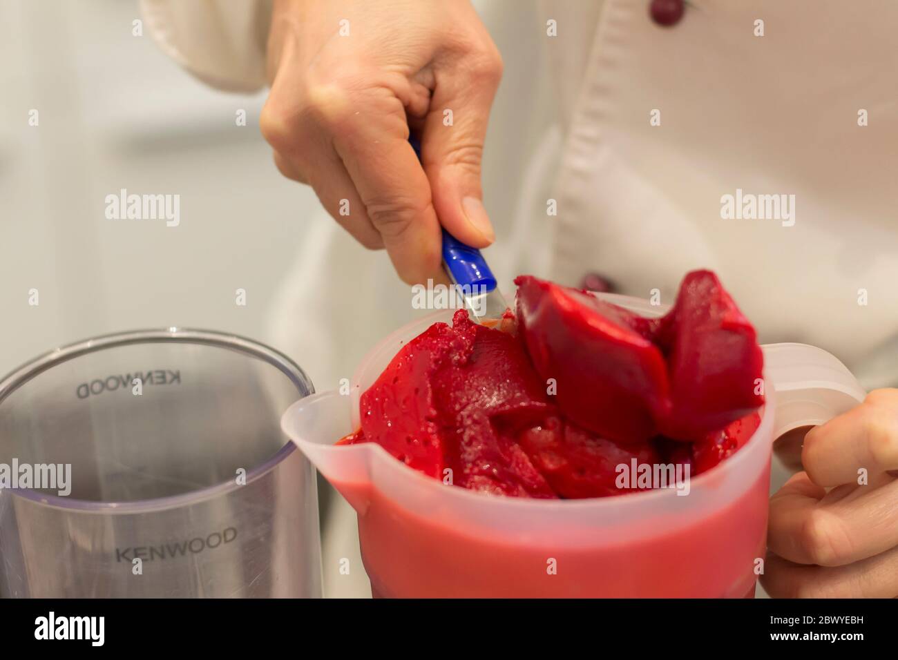 Close up on the preparation of a strawberry cheesecake inside a ...