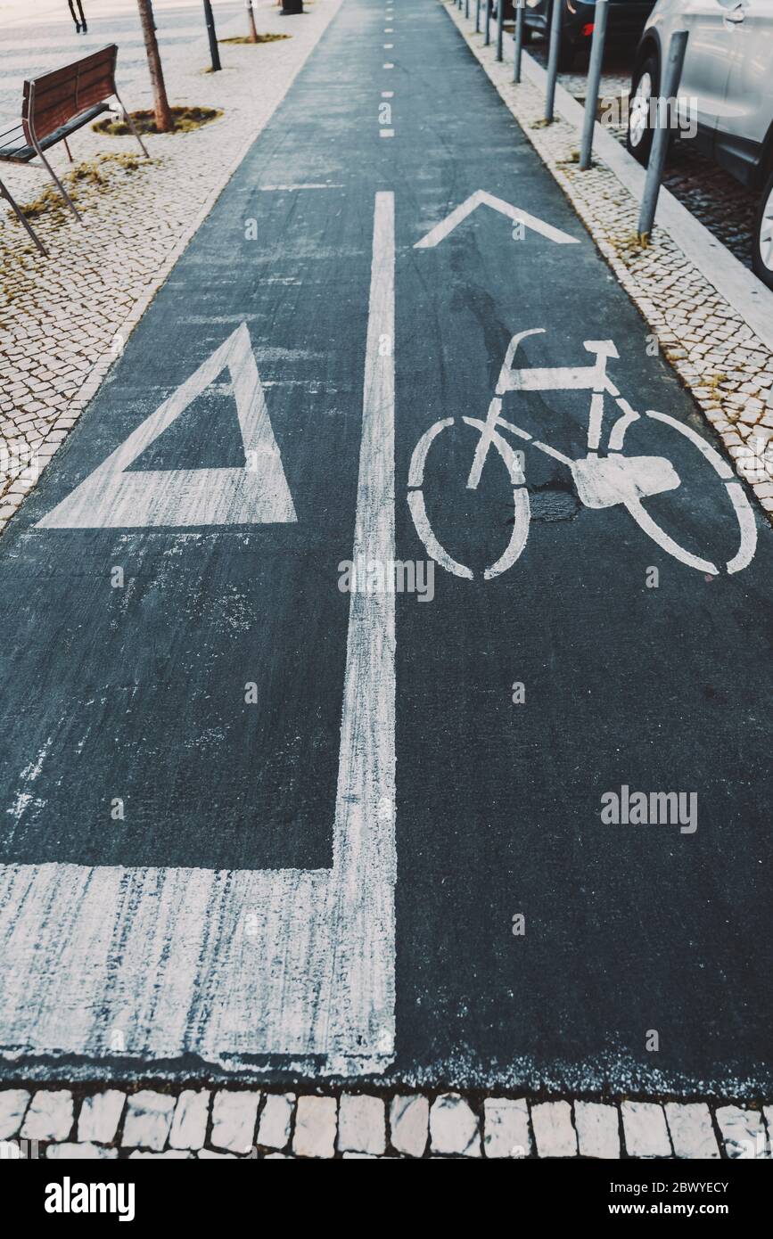 Wide-angle vertical view of a road marking sign on asphalt on a bicycle ...