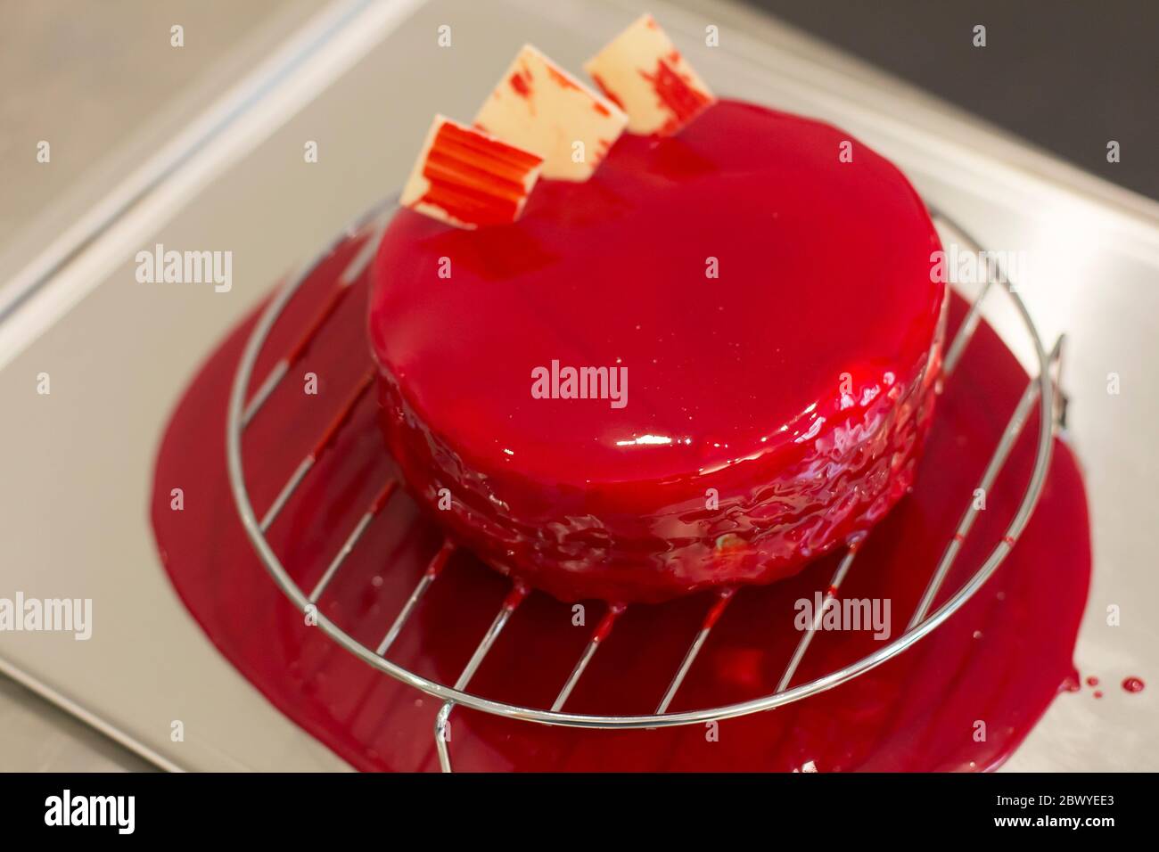 Close up on the preparation of a strawberry cheesecake inside a ...