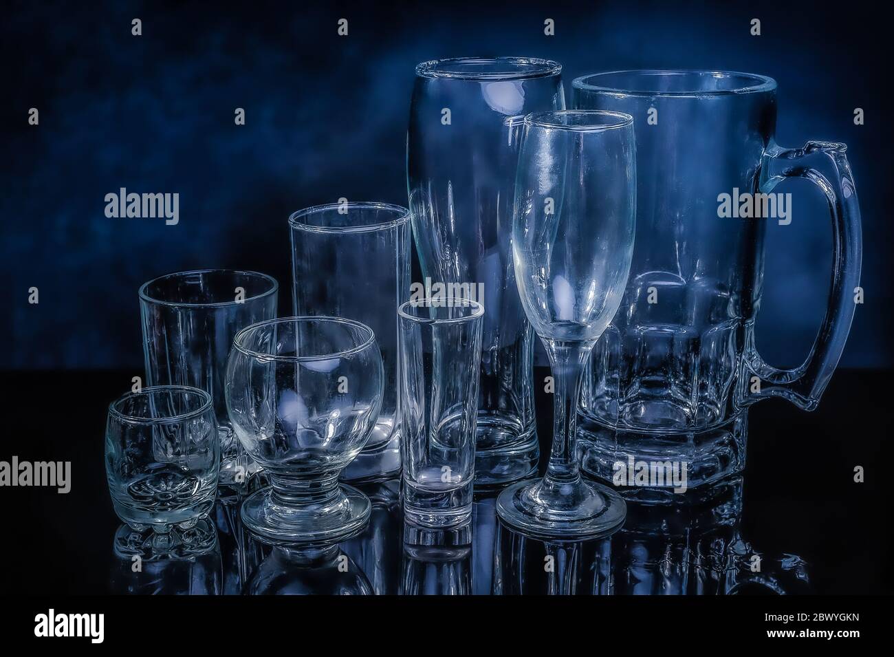 glass drinkwares and stemwares of different shapes and sizes stand side ...
