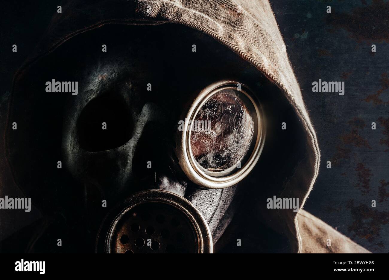 Photo of a stalker man in soviet gas mask and skull face closeup view ...