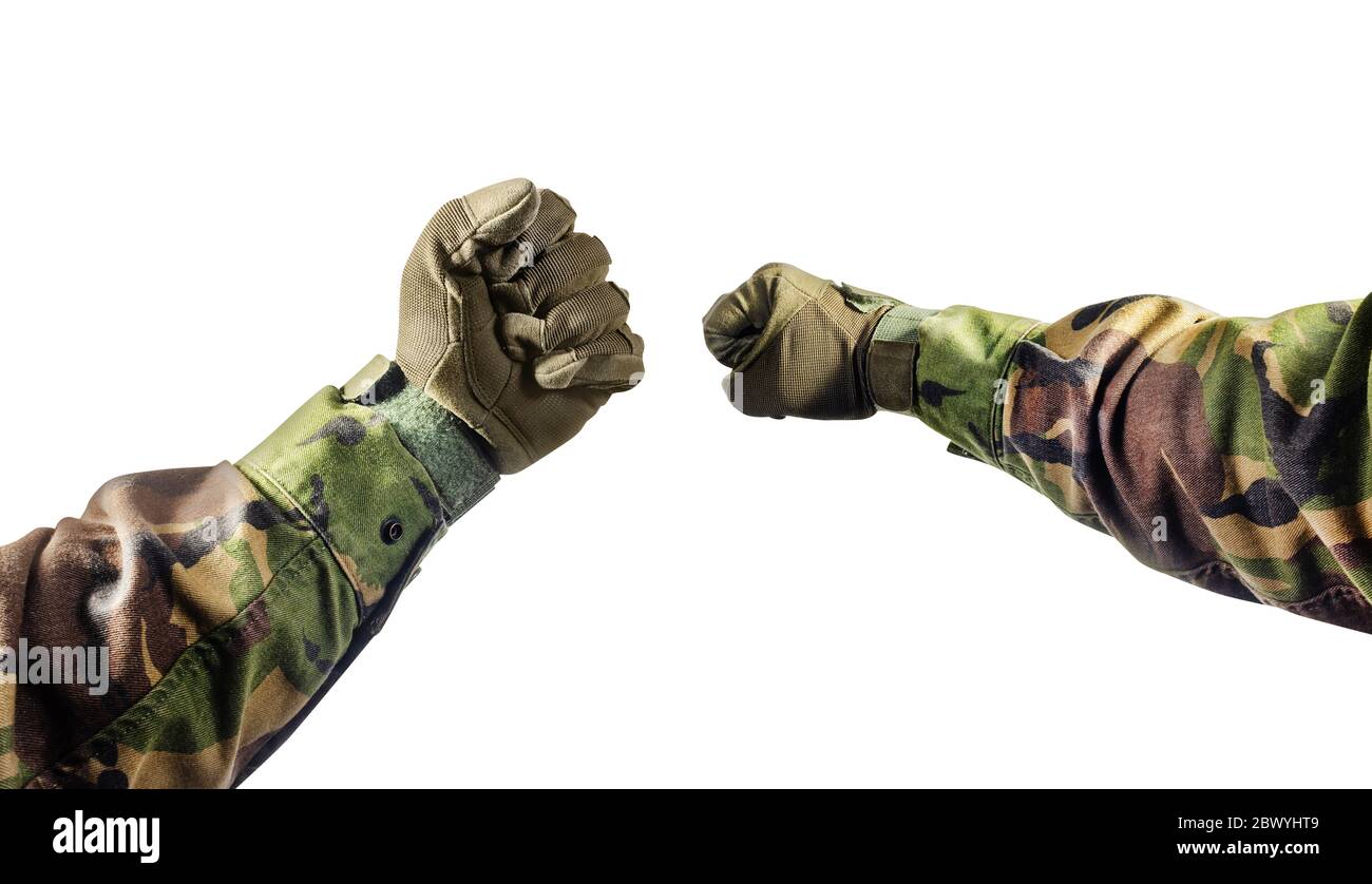 Isolated photo of a first person view soldier fists in tactical gloves ...