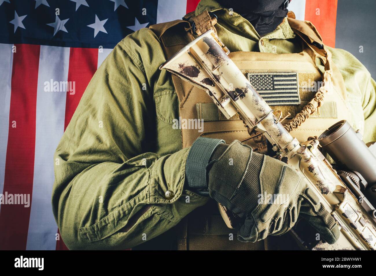 Photo of a fully equipped soldier in tactical armor vest and rifle ...