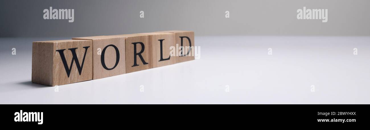 World word made of wooden cubes in white background Stock Photo - Alamy