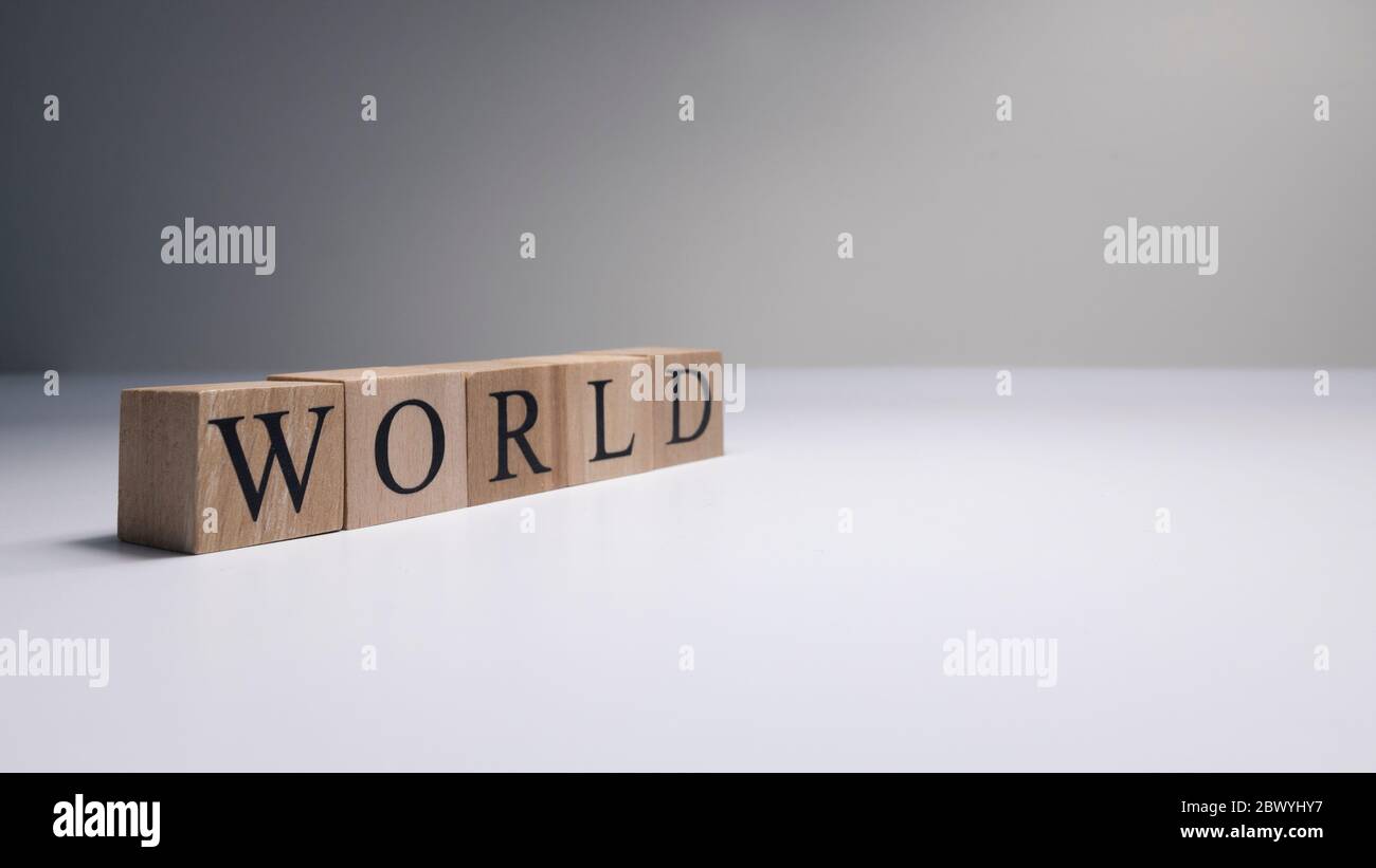 World word made of wooden cubes in white background Stock Photo - Alamy