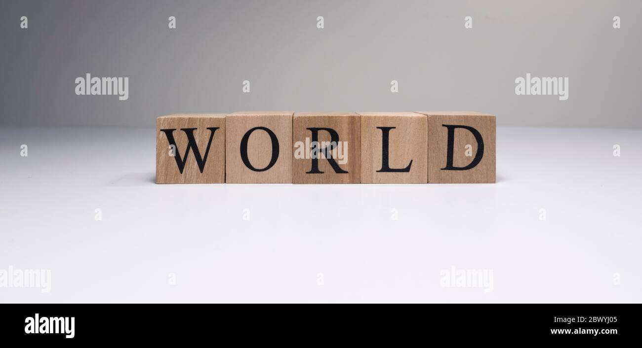 World word made of wooden cubes in white background Stock Photo - Alamy