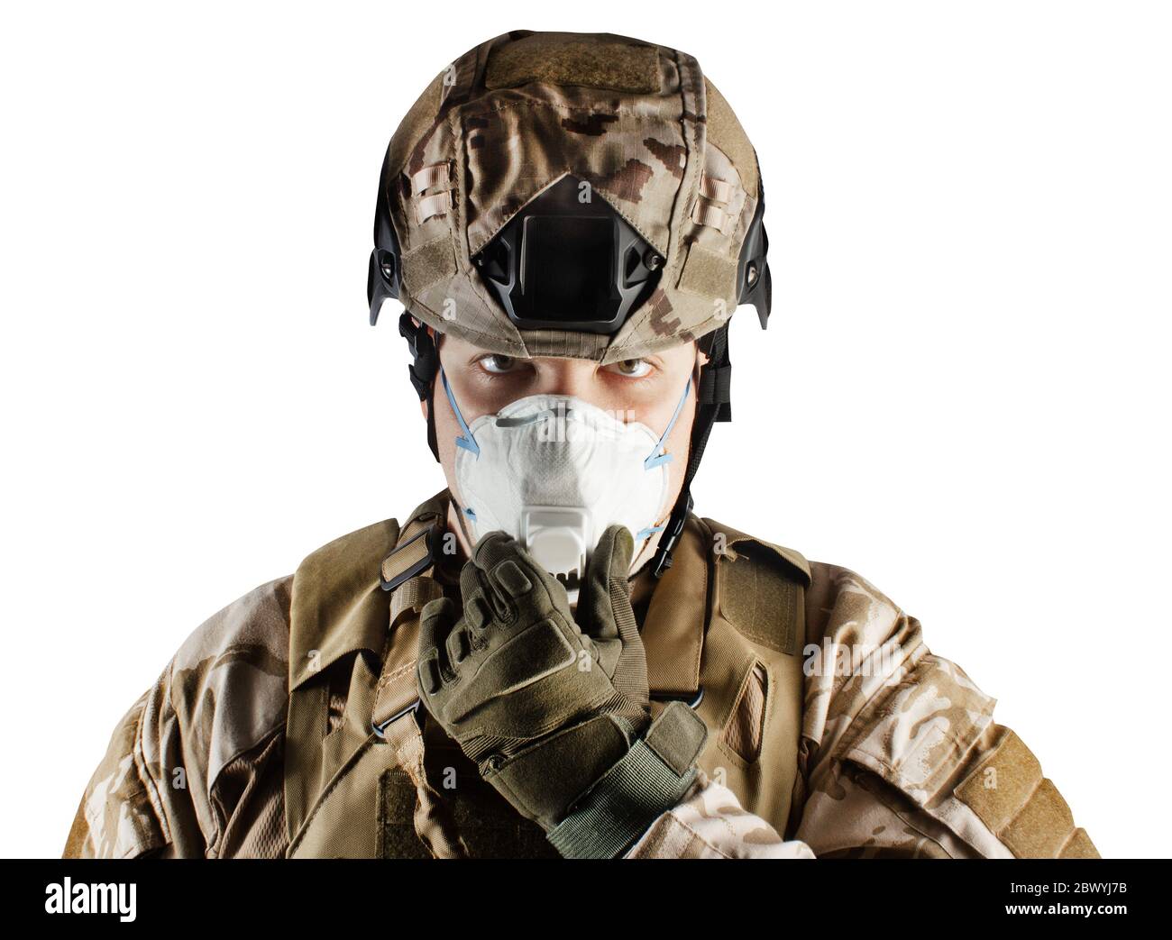 Isolated photo of a fully equipped soldier in uniform putting on ...