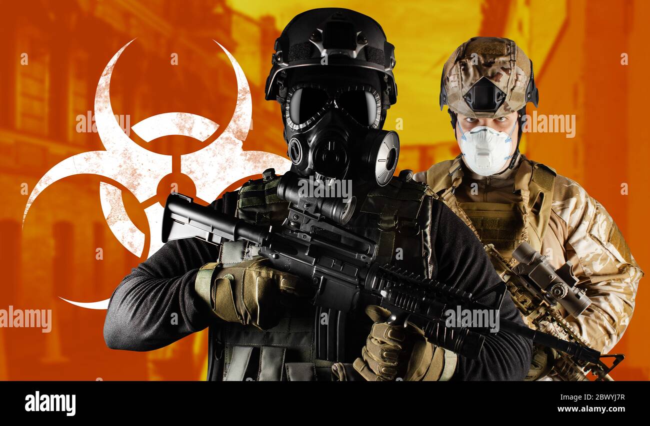 Photo of a fully equipped soldiers in gas mask, respirator and rifles ...