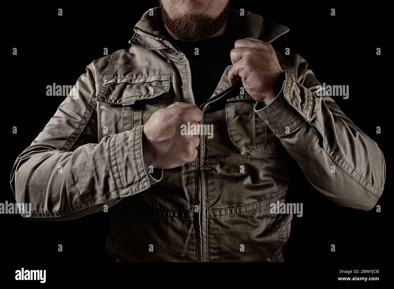 Young man putting on jacket hi-res stock photography and images - Alamy