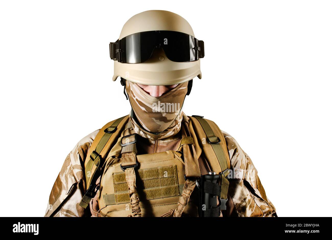 Isolated photo of a fully equipped desert soldier in helmet, armor and ...