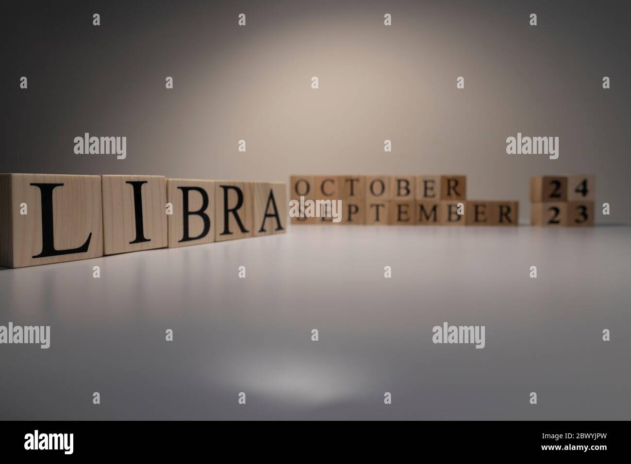 Libra word on wooden cubes on white background Stock Photo - Alamy