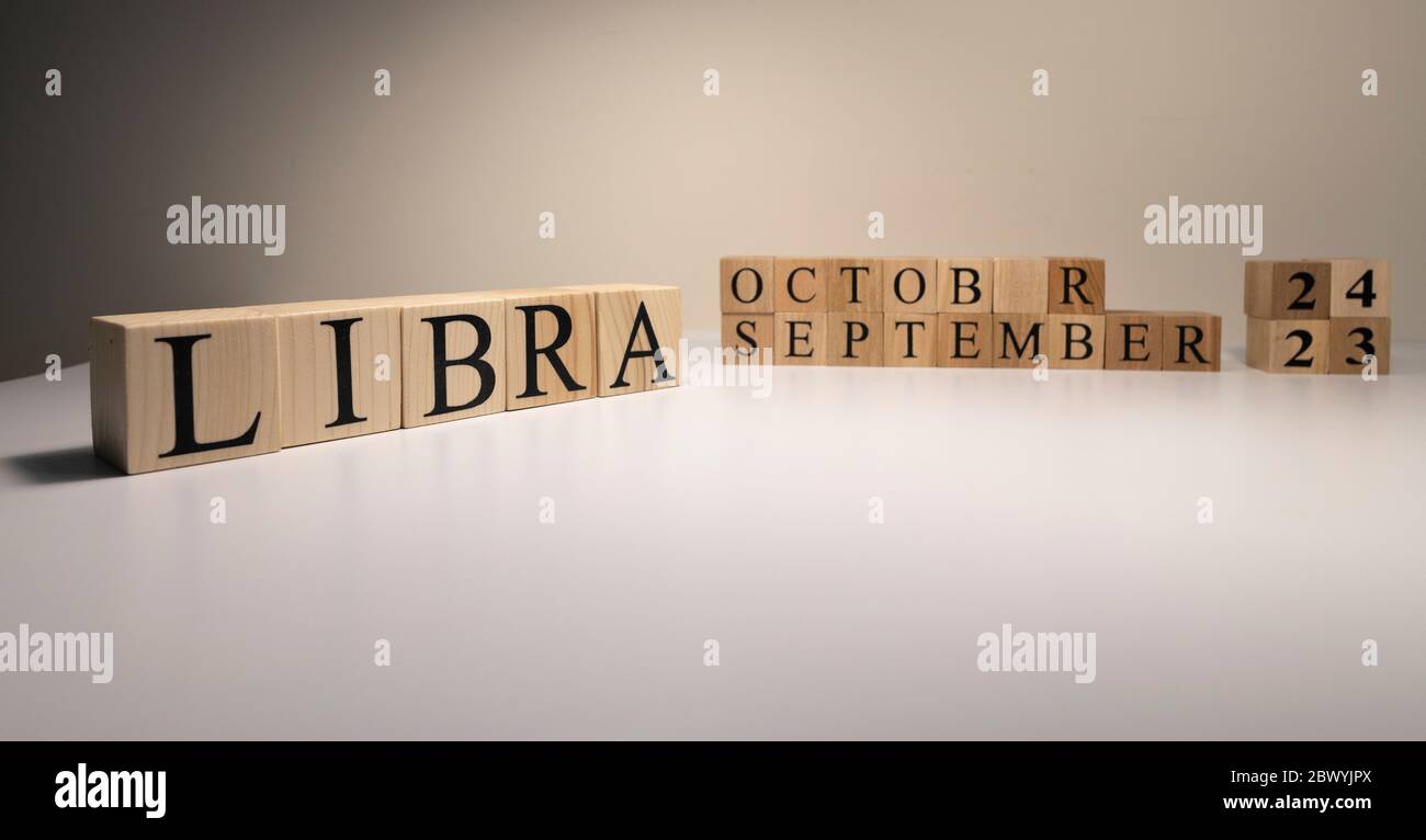 Libra word on wooden cubes on white background Stock Photo - Alamy