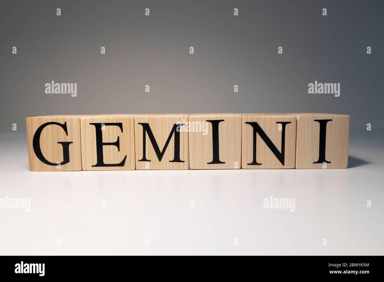 Gemini word on wooden cubes on white background Stock Photo - Alamy