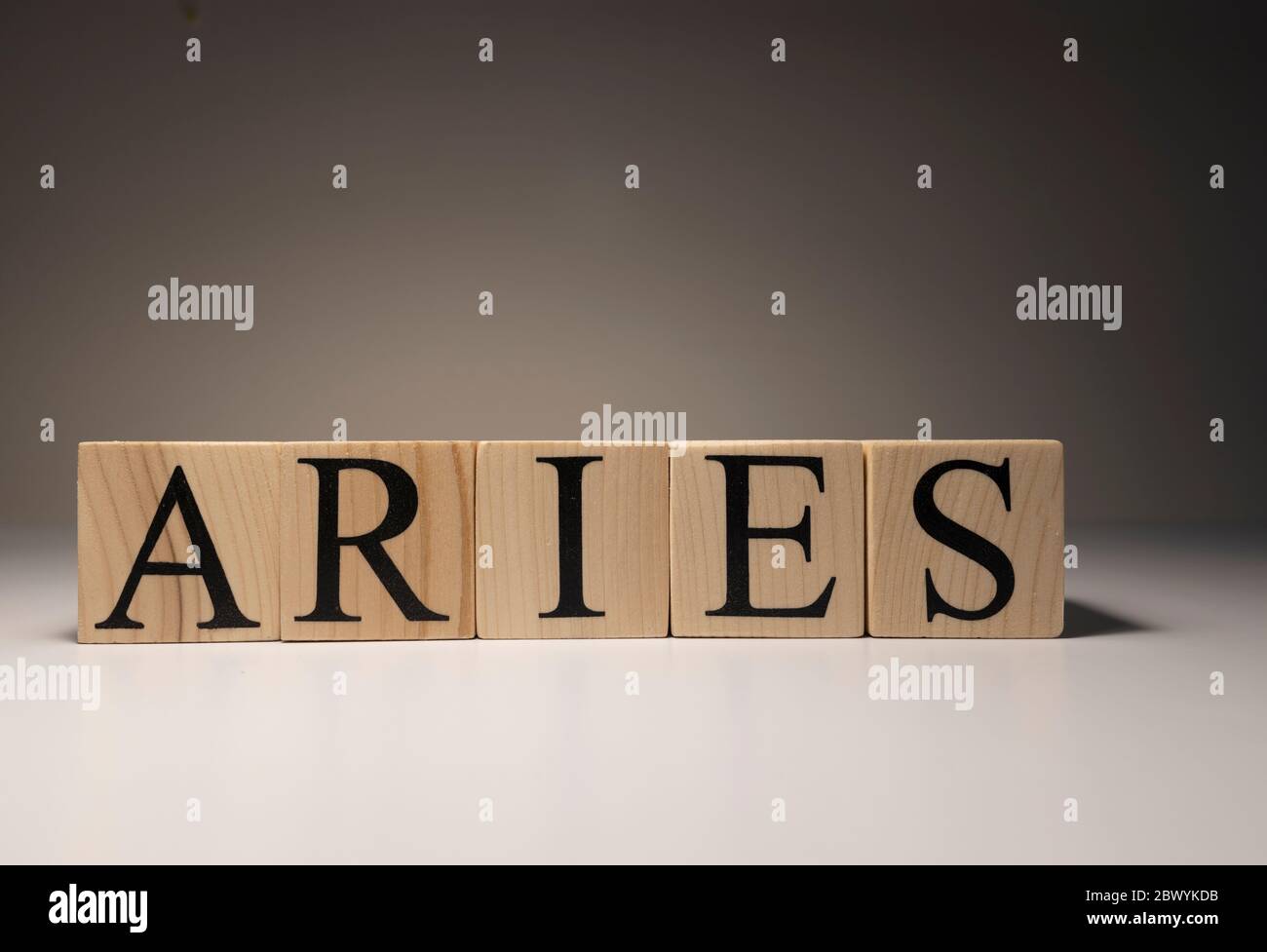 Aries word on wooden cubes on white background Stock Photo - Alamy