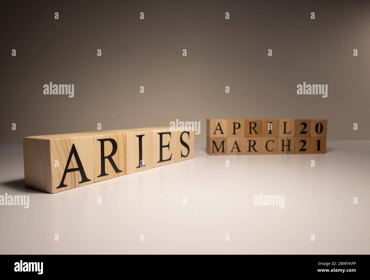 Aries word on wooden cubes on white background Stock Photo - Alamy