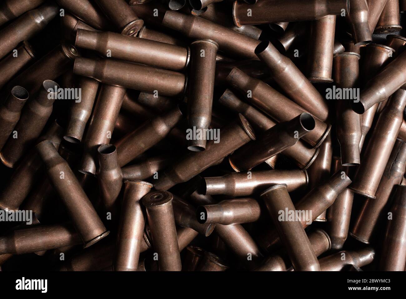 Pile of rifle gun shells laying, upper view Stock Photo - Alamy