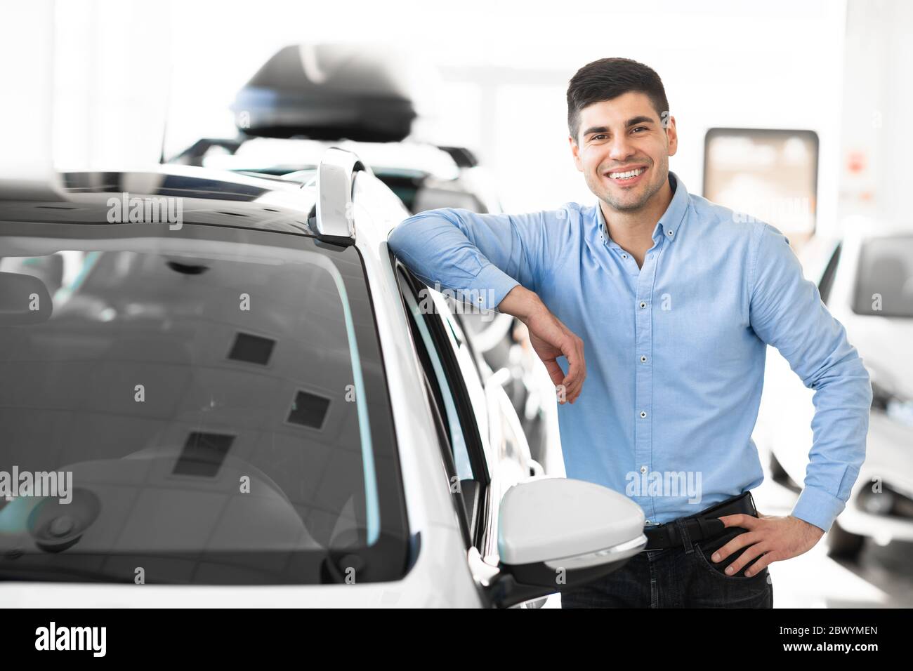 Male dealer standing auto salon hi-res stock photography and images - Alamy