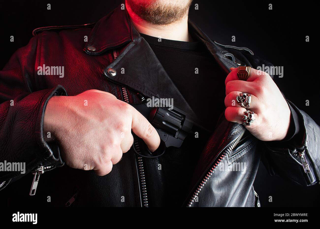 Man with gun leather jacket hi-res stock photography and images - Alamy