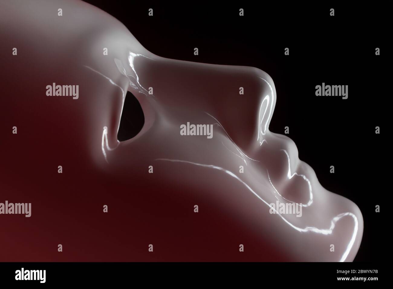 Photo of a white plastic human mask shape with red highlights profile ...