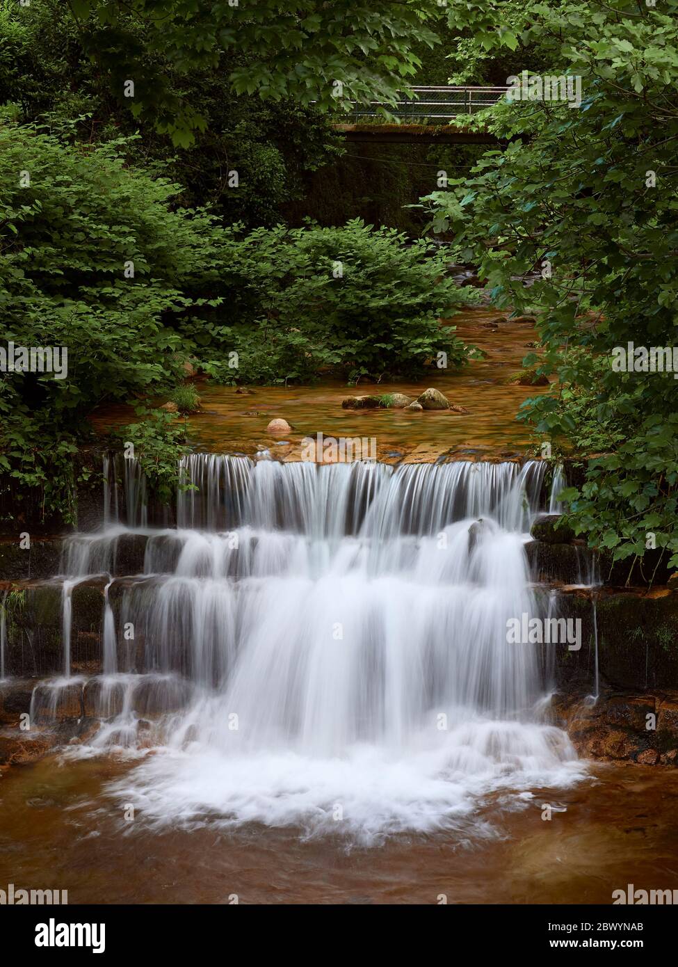Waterfall of river gerês that runs between the trees before fall throw ...