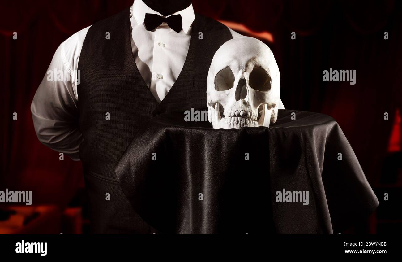 Horror photo of a waiter in white shirt and black waistcoat holding ...